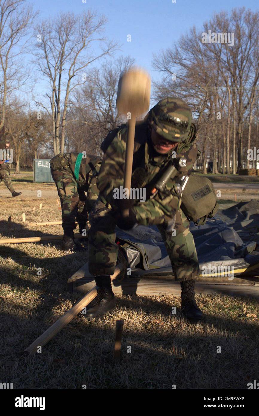 US Air Force SENIOR AIRMAN Miller, 1ST Civil Engineering Squadron, uses ...