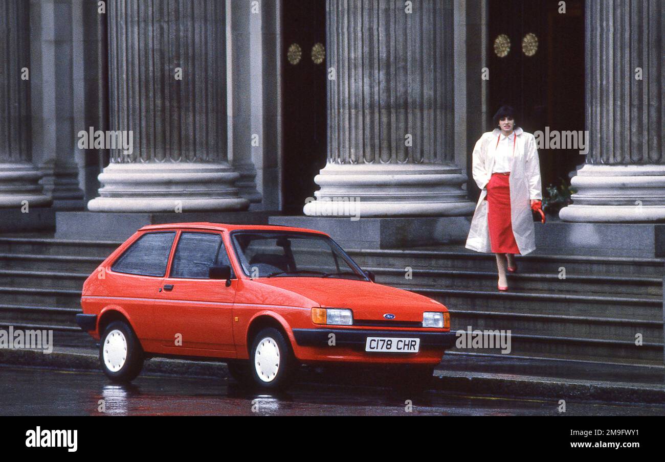 Woman with a 1985 Ford Fiesta in the City of London UK Stock Photo - Alamy