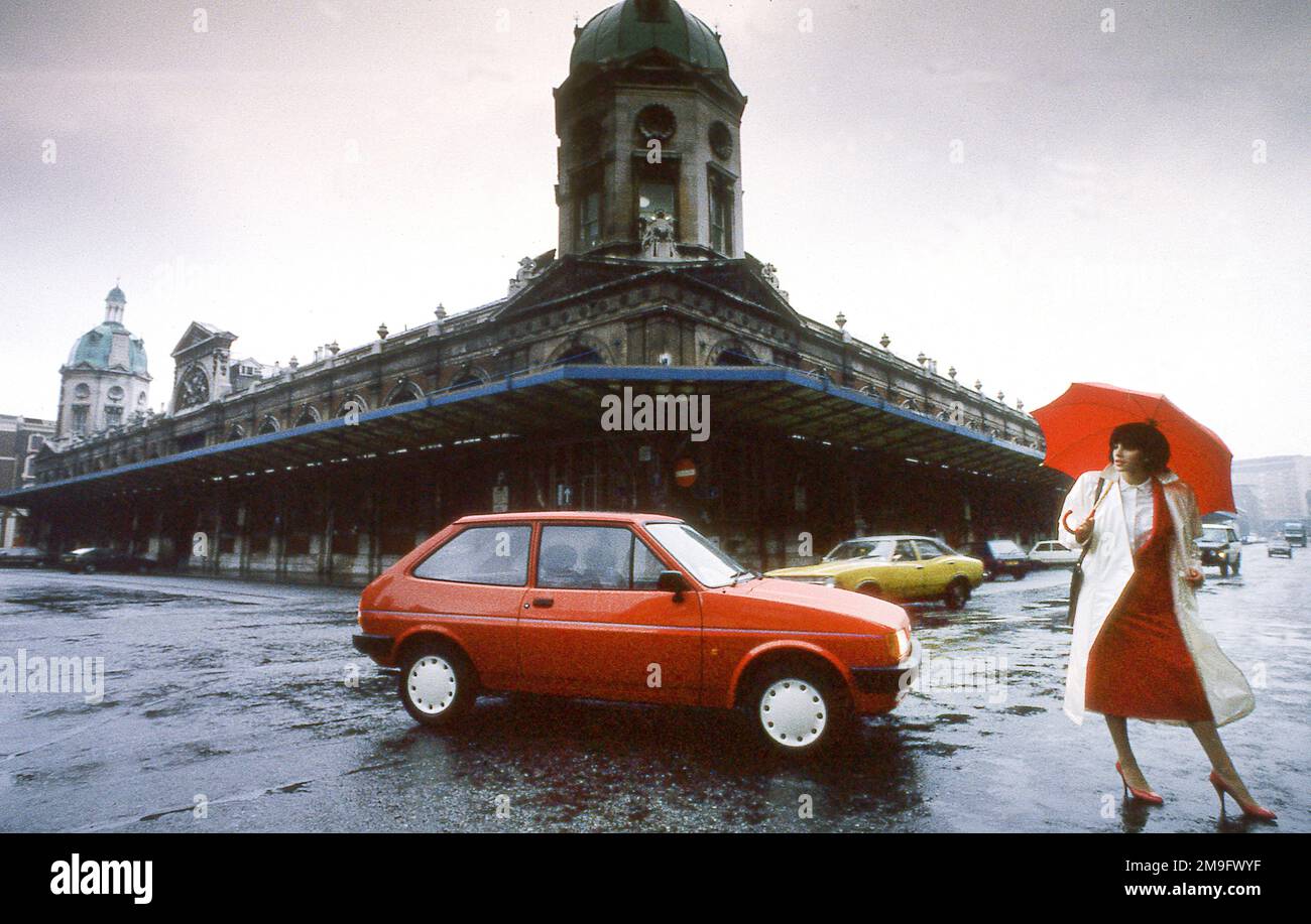 Woman with a 1985 Ford Fiesta in the City of London UK Stock Photo - Alamy