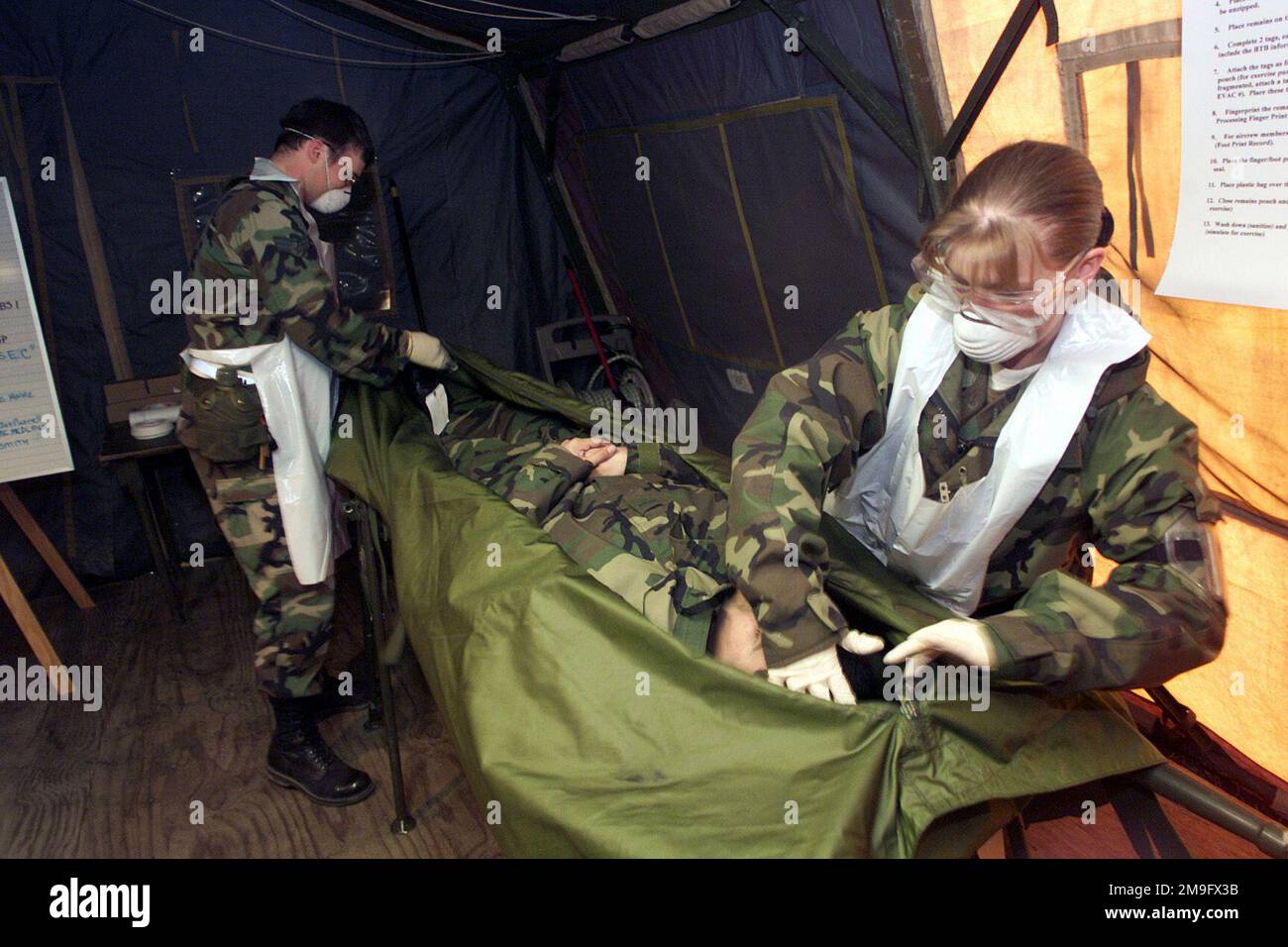 US Air Force SENIOR AIRMAN Jeremy Obenchain, left, and US Air Force ...