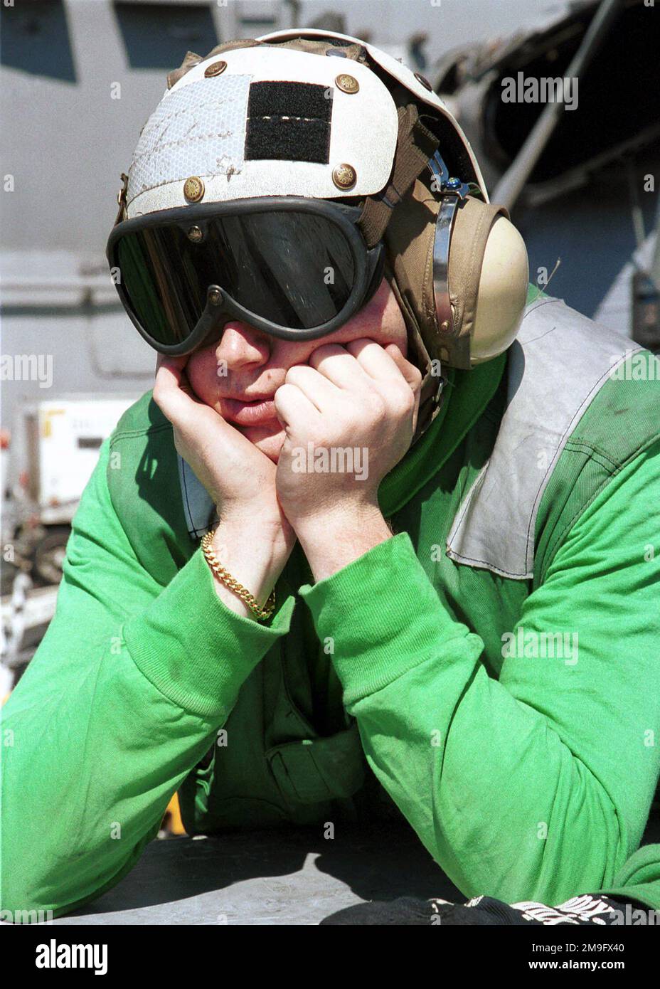 Postal Clerk SEAMAN Lucas Reese from Odessa, Texas, waits on the flight ...