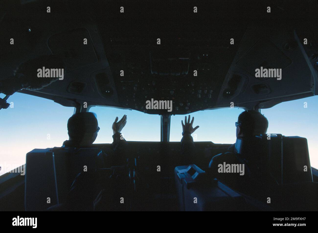 Silhouette of McGuire Air Force Base aircrew members waving to the cast ...