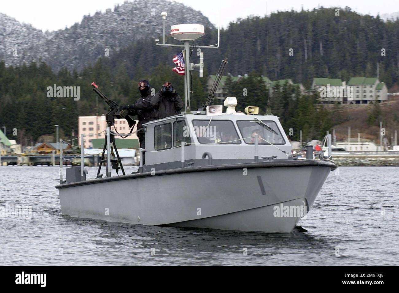 Members of Navy Inshore Boat Unit 12, Seattle, Washington, man .50 ...