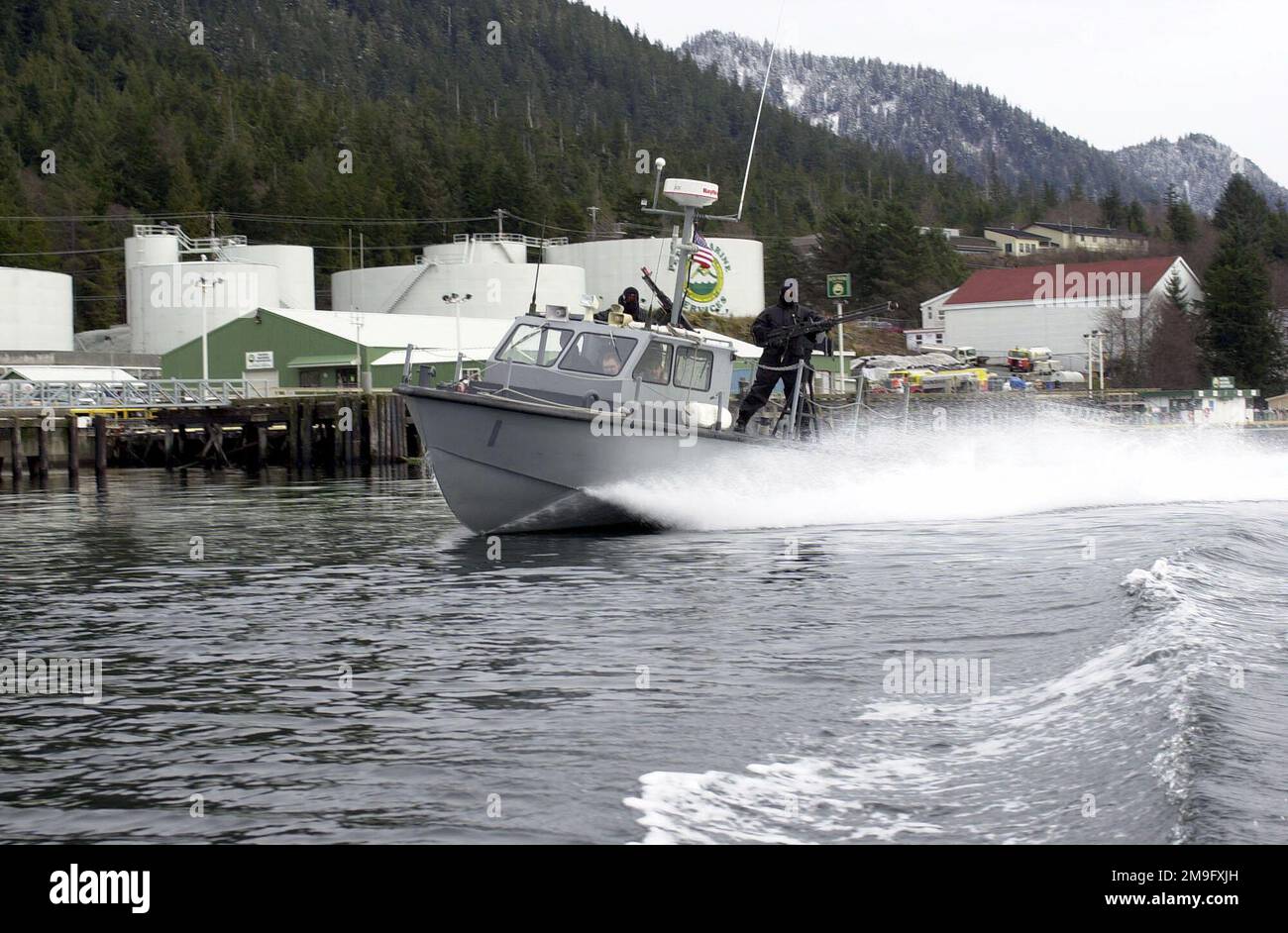 A boat from Navy Inshore Boat Unit 12, Seattle, Washington, provides ...