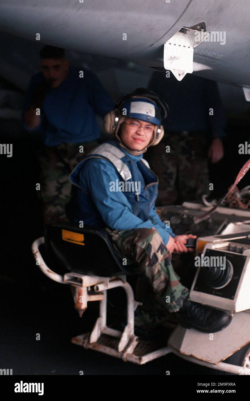A US Navy Sailor from the USS TARAWA (LHA 1) working on the flight deck ...