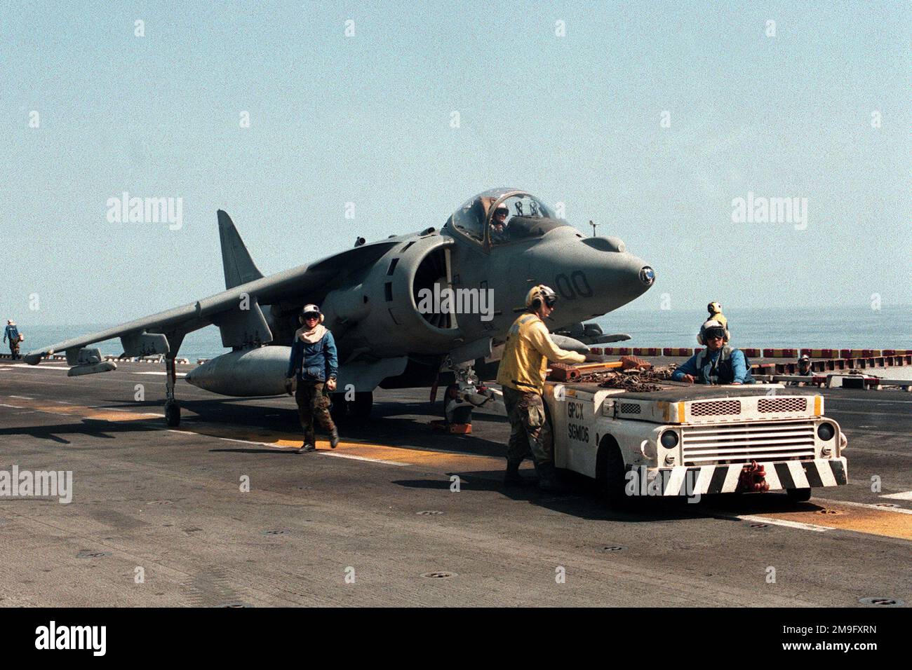 An AV-8B Harrier aircraft prepares for take off aboard the USS TARAWA ...