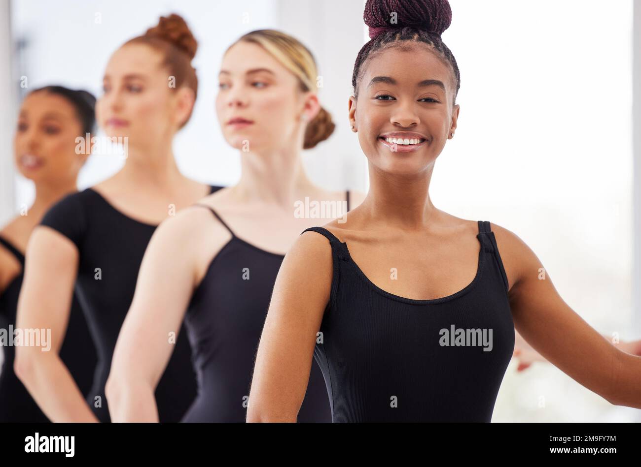 Practicing to ensure a perfect performance. a group of ballet dancers ...