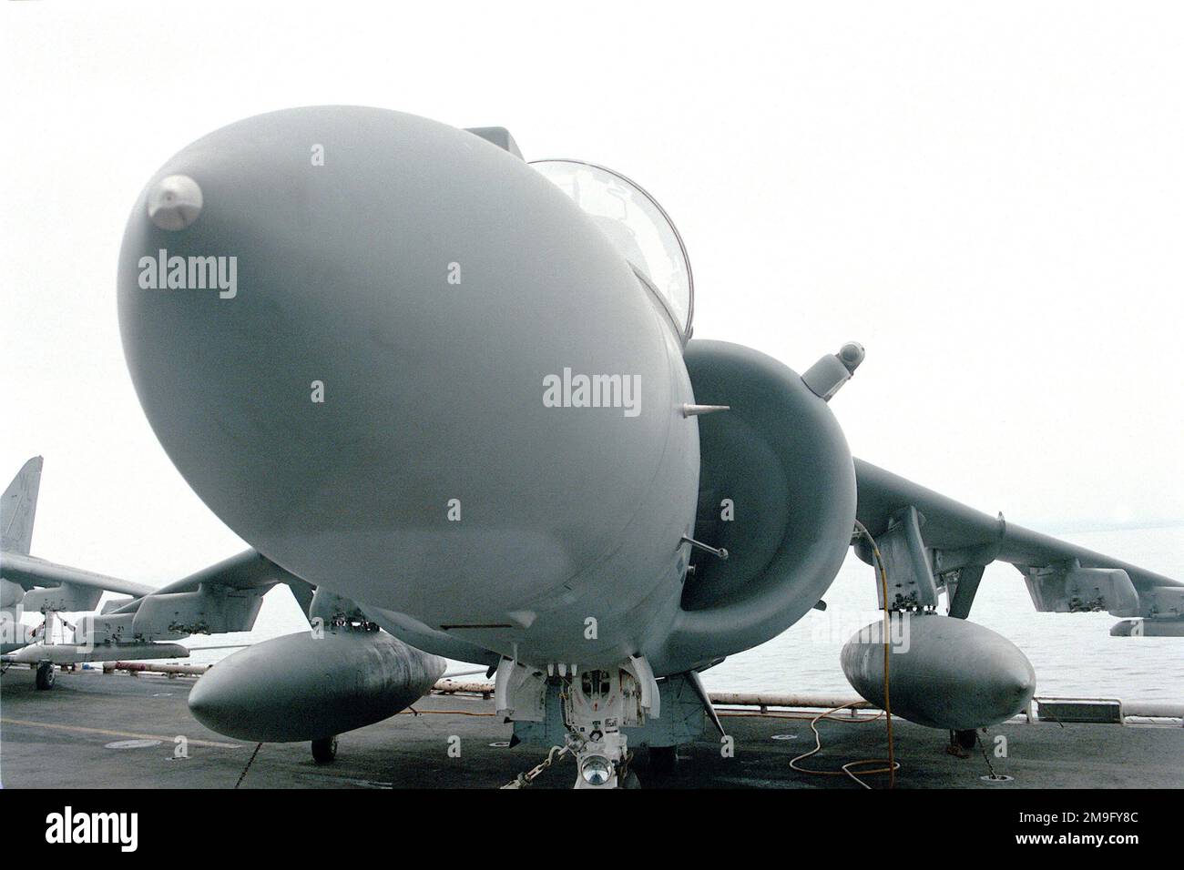 An AV-8B Harrier aircraft onboard the flight deck of the USS TARAWA ...