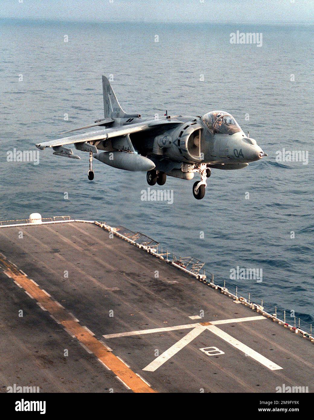 An AV-8B Harrier aircraft lands aboard the USS TARAWA (LHA 1) during ...