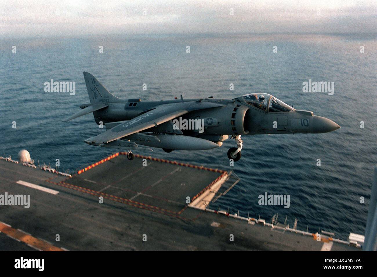 An AV-8B Harrier aircraft lands aboard the USS TARAWA (LHA 1) during ...
