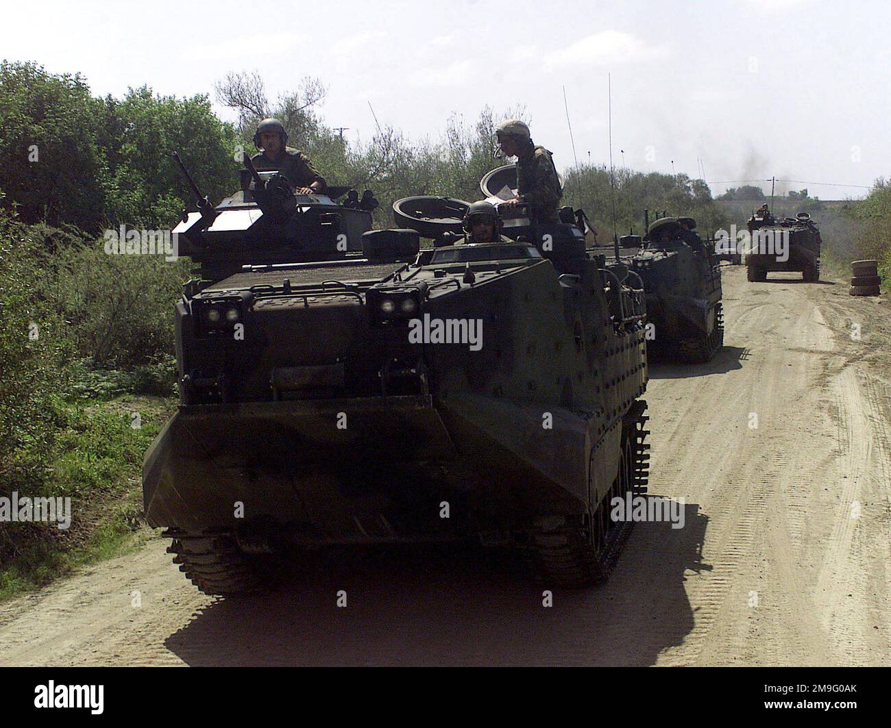 A convoy of US Marine Corps (USMC) Amphibious Assault Vehicles (AAV7A1 ...