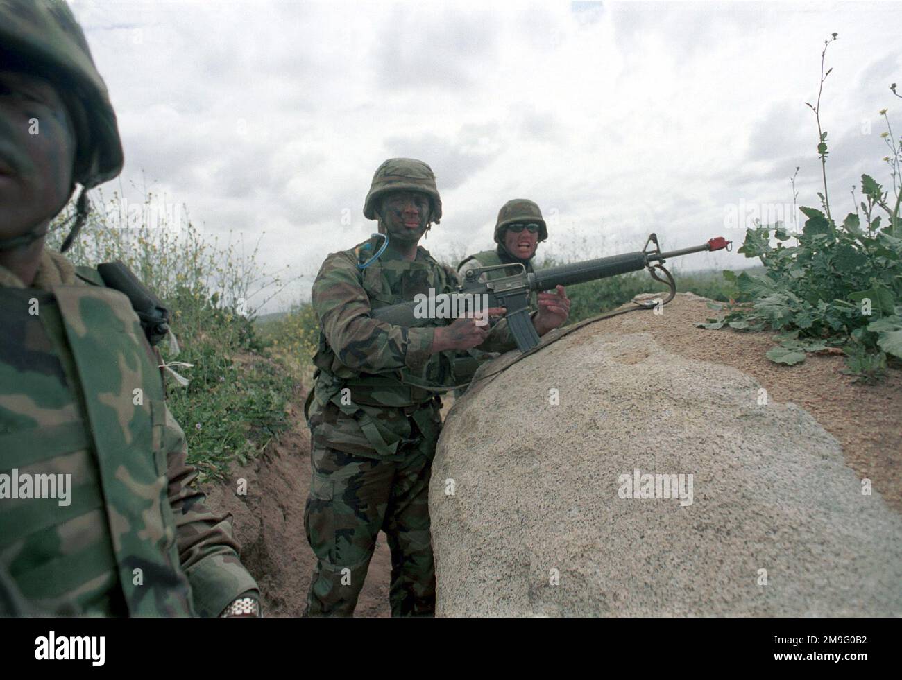 US Marine Corps (USMC) Lance Corporal (LCPL) William Saxton (center ...