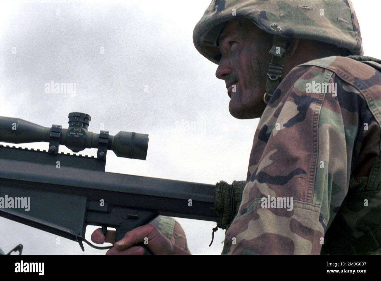 US Marine Corps (USMC) Corporal (CPL) Joe Rattlif mans a 12.7mm .50 in ...