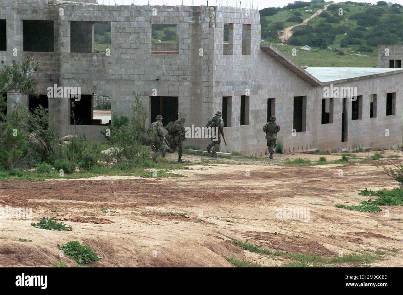 Armed US Marine Corps (USMC) personnel from 3rd Battalion, 4th Marine ...