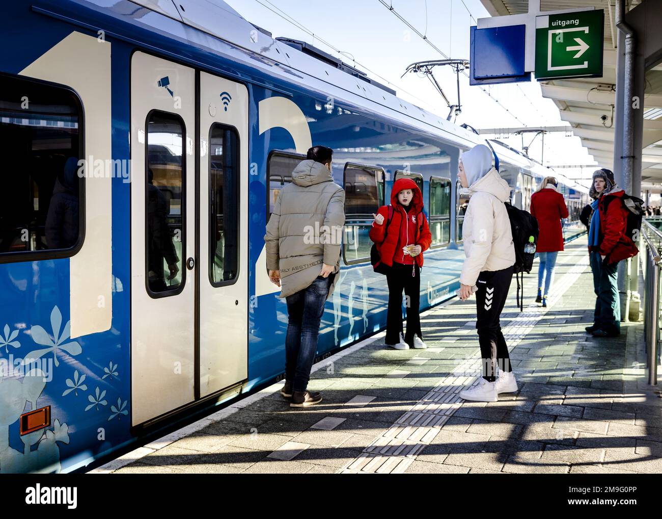 ZWOLLE - Travelers at a regional train of the carrier Keolis. Thousands ...