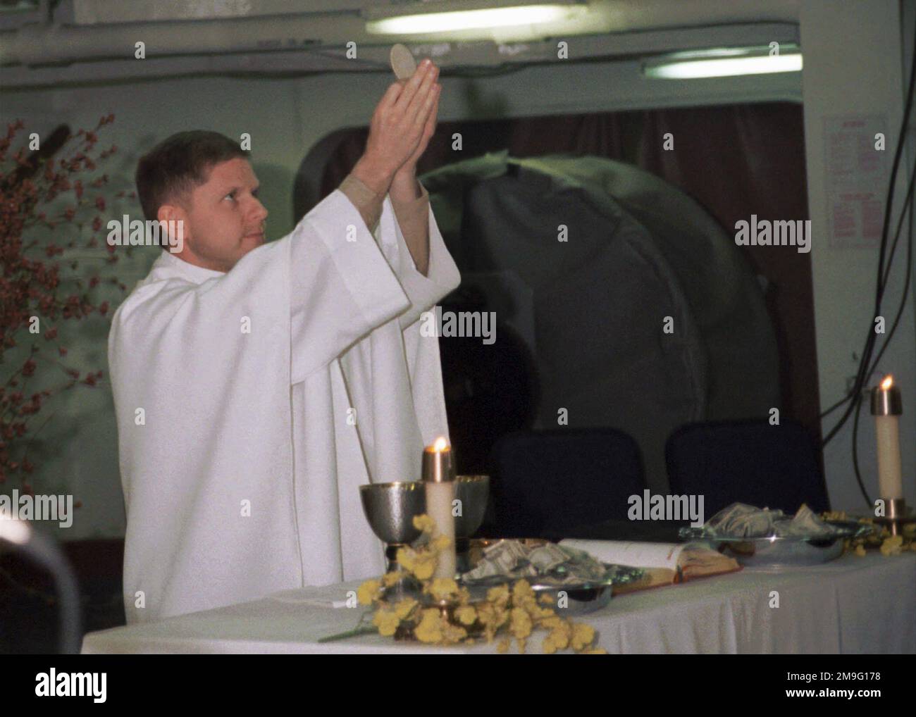 US Navy Chaplain Lieutenant Commander Robert Coyle leads an Easter Mass ...