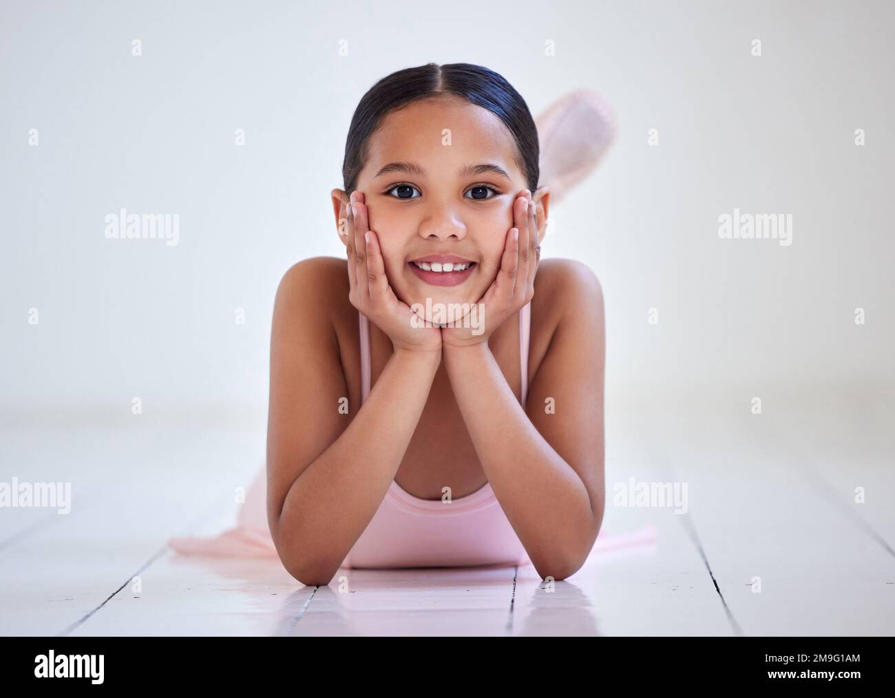 Shes the cutest ballerina girl. Portrait of a little girl lying on the ...