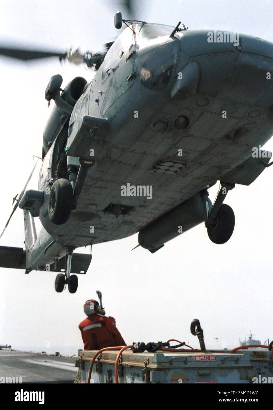 US Navy Aviation Ordnanceman Second Class Toby Snowden serves as safety ...