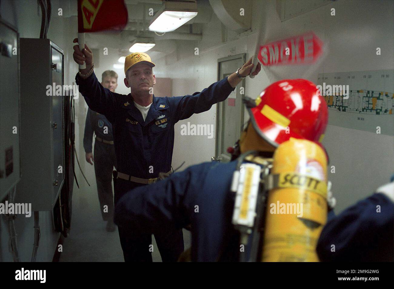 US NavyEngineman MASTER CHIEF Michael Spaugy signals to a fire team ...