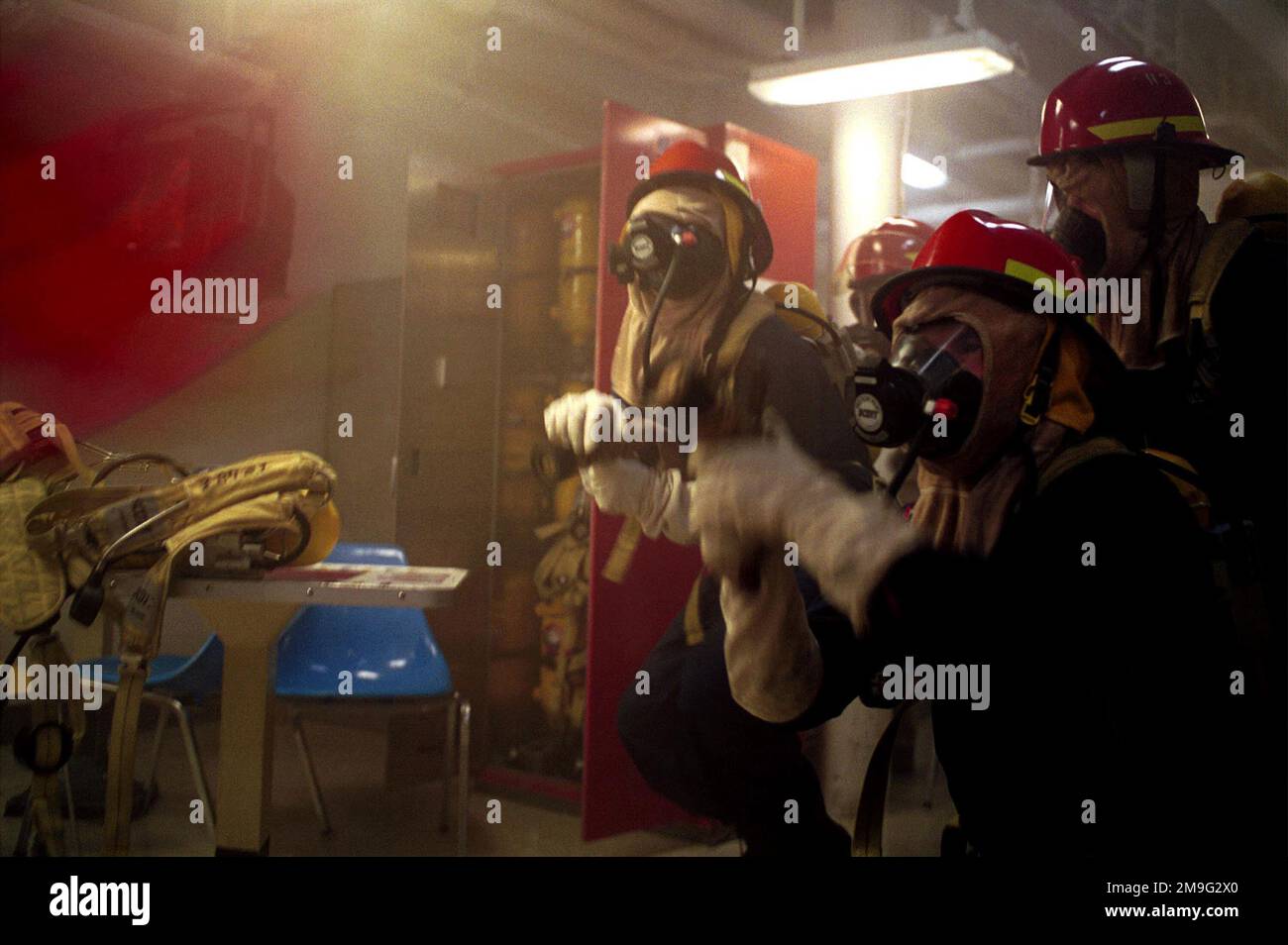 A fire team prepares to fight a Class Alpha fire during a general ...