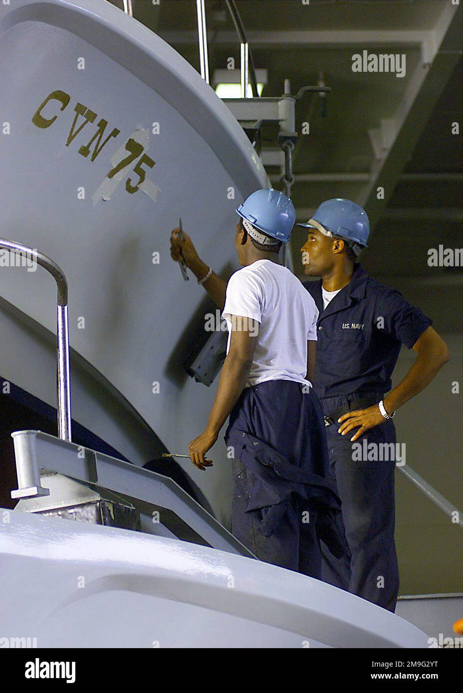 US Navy SEAMAN Aundrell Powell and US Navy SEAMAN Edwin Malloy paint ...