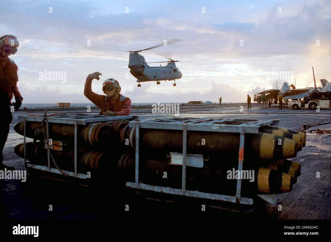 US Navy (USN) Ordnance Crewmembers prepare to move Mk-82 500-pound ...