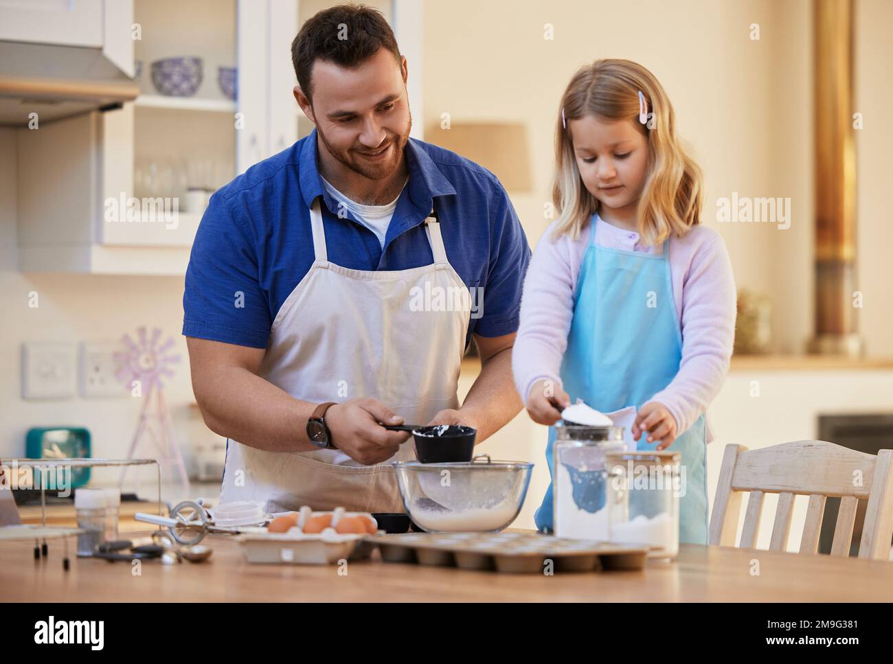 Teaching my daughter the tricks of the trade. a young father helping ...
