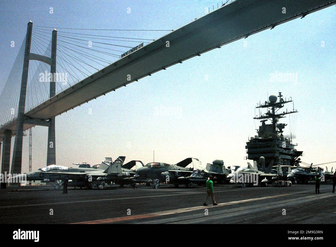 USS HARRY S. TRUMAN (CVN 75) passes under a newly constructed ...