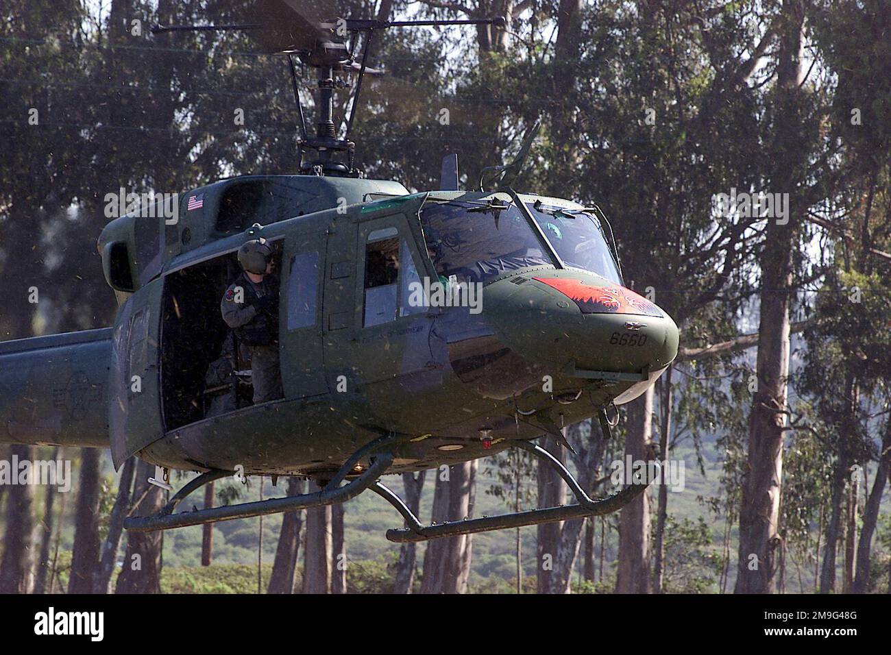010508-F-9753B-002. [Complete] Scene Caption: As the UH-1N Iroquois ...