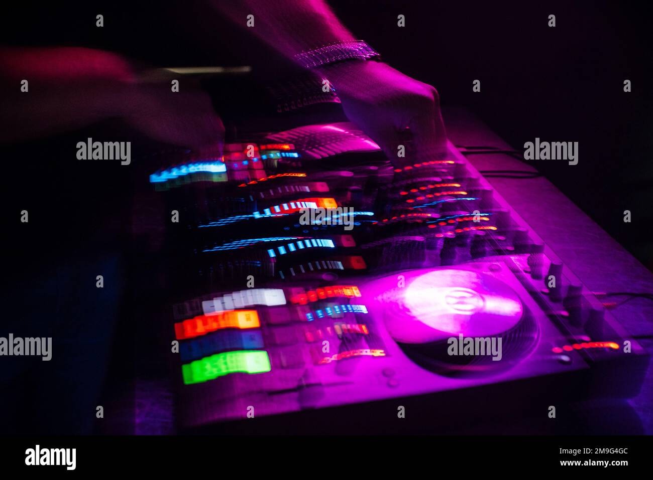 DJ mixer controller with colored with multi-colored effect smudge from ...