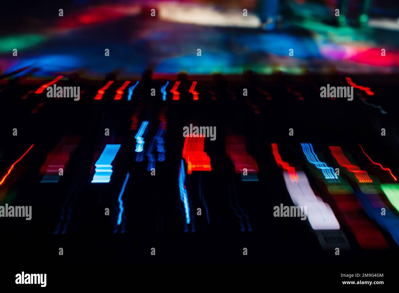 DJ mixer controller Board with color effects from long exposure in a ...