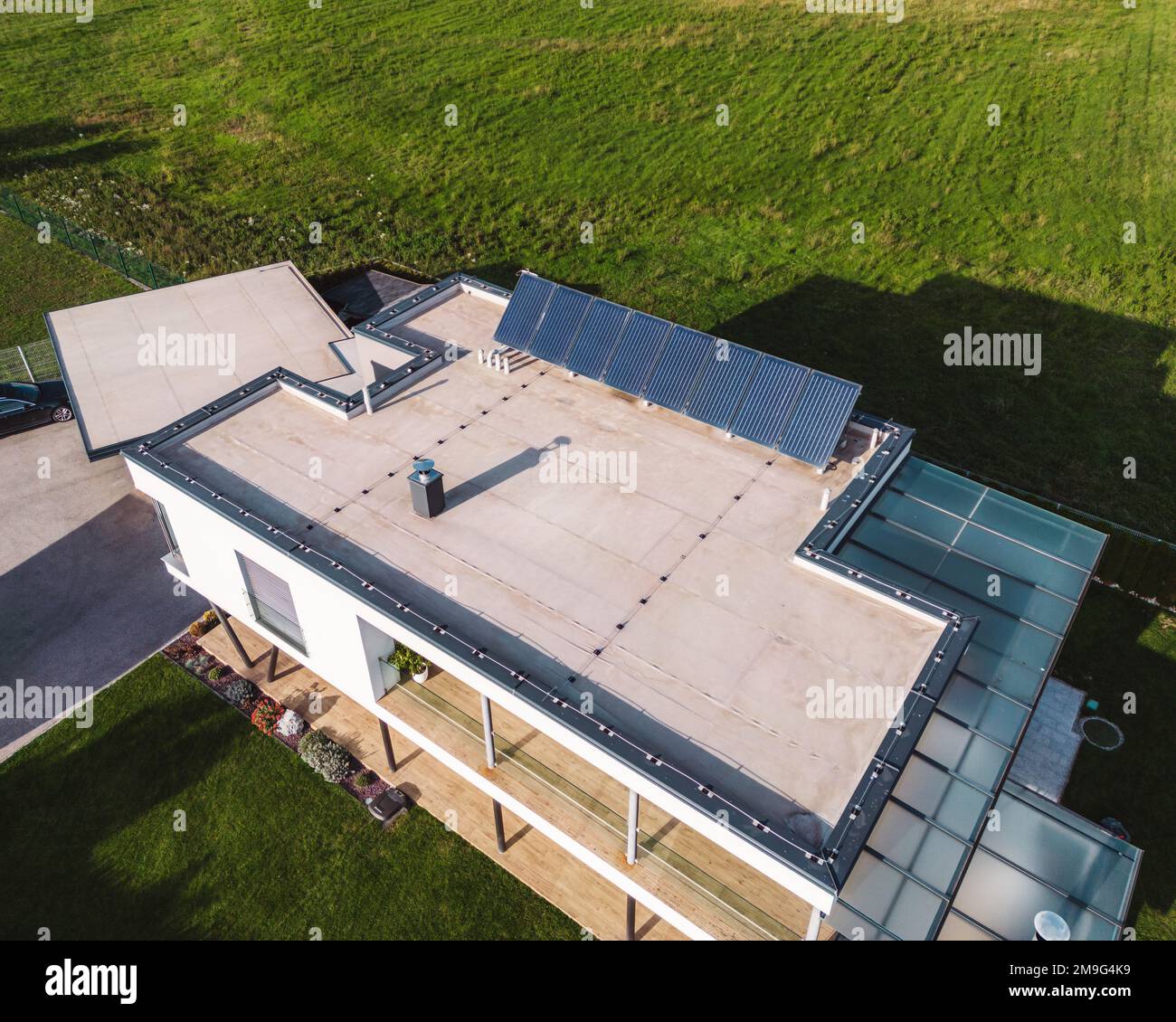 Top view of building rooftop with solar energy collector panels hi-res ...