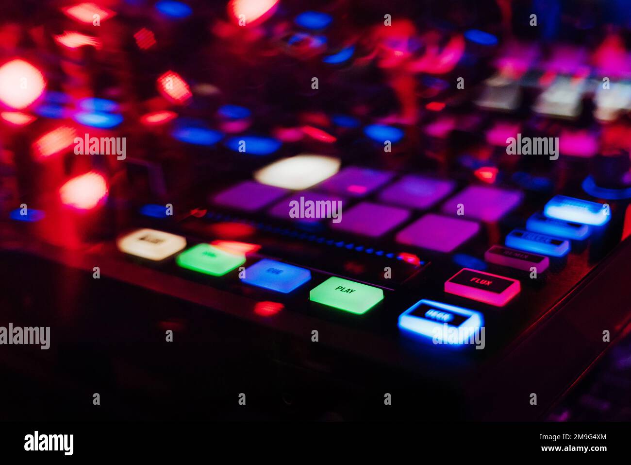 professional DJ mixer controller for mixing music in a nightclub with ...