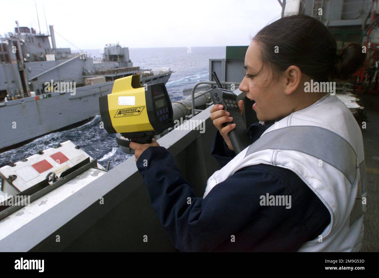 US Navy Quartermaster Third Class Patricia Muniz uses a distance range ...