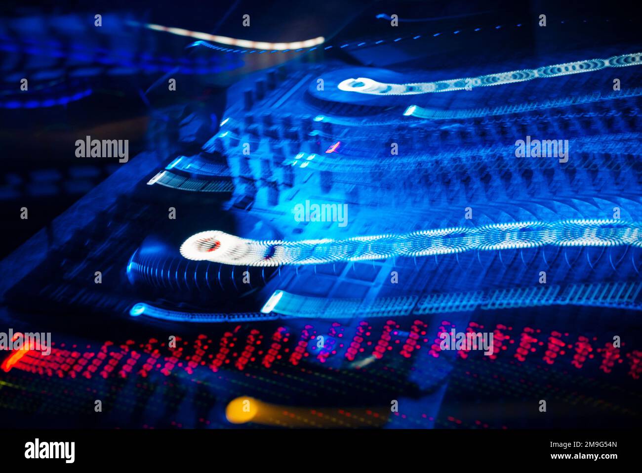 DJ mixer controller Board with color effects from long exposure in a ...