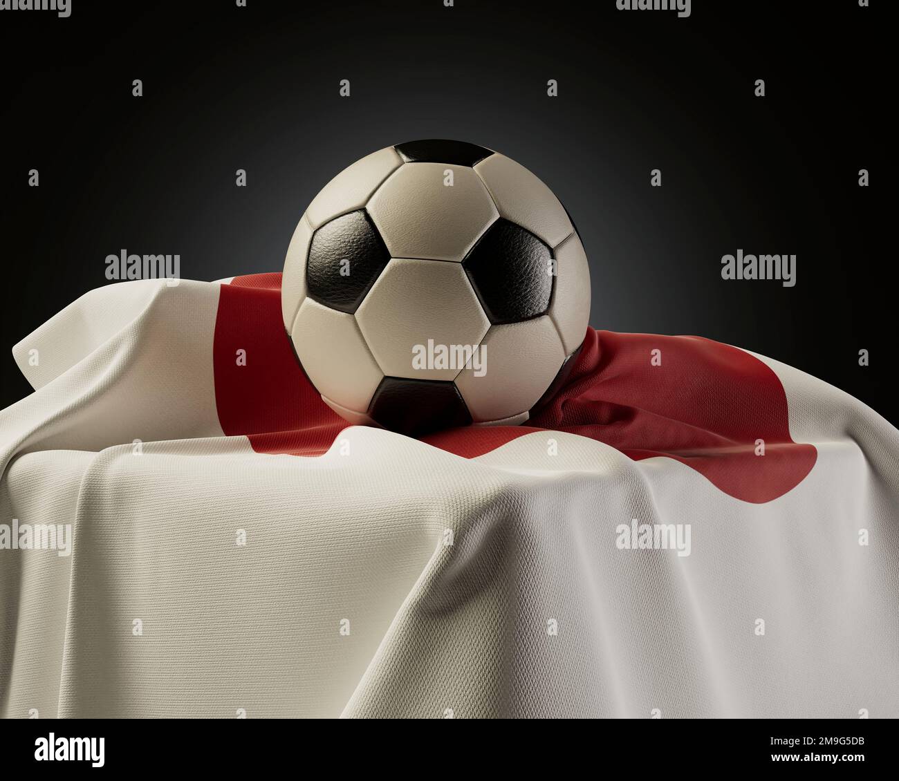 A regular soccer ball resting on a Japan flag draped over a plinth on ...