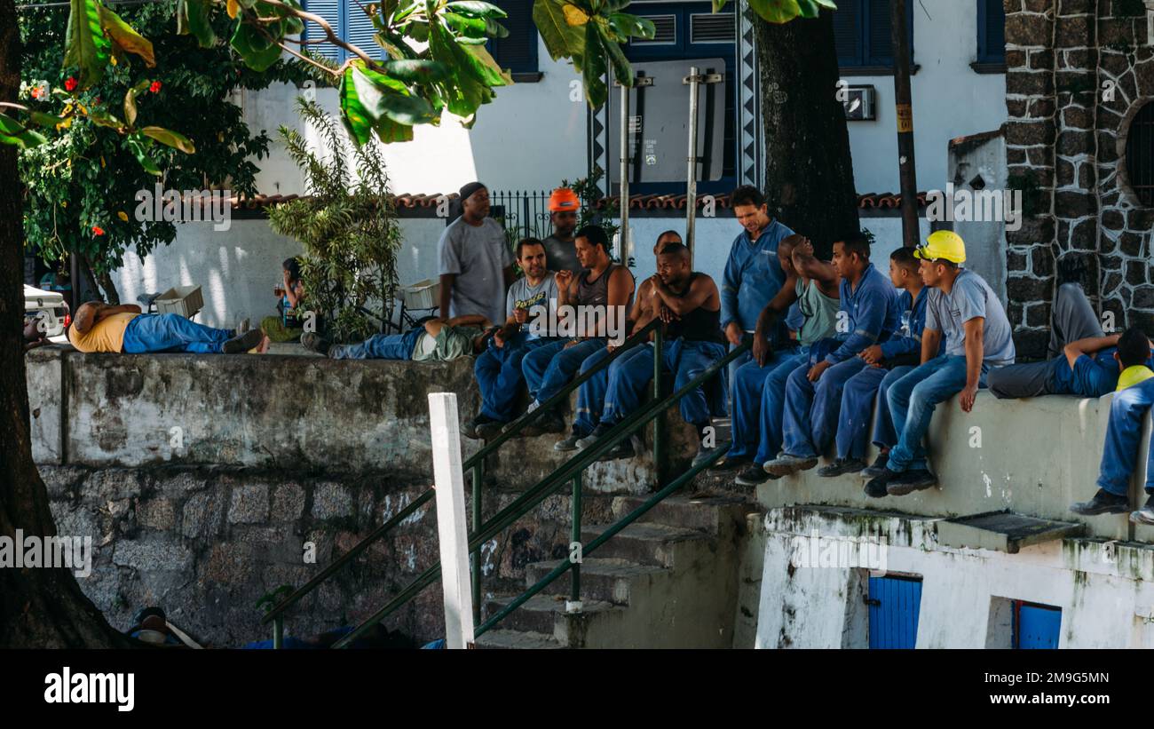 Construction workers in Rio de Janeiro, Brazil relax on the shade at ...