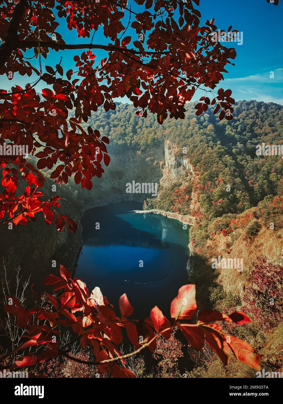 A view of charming lake in the scenic autumn terrain Stock Photo - Alamy
