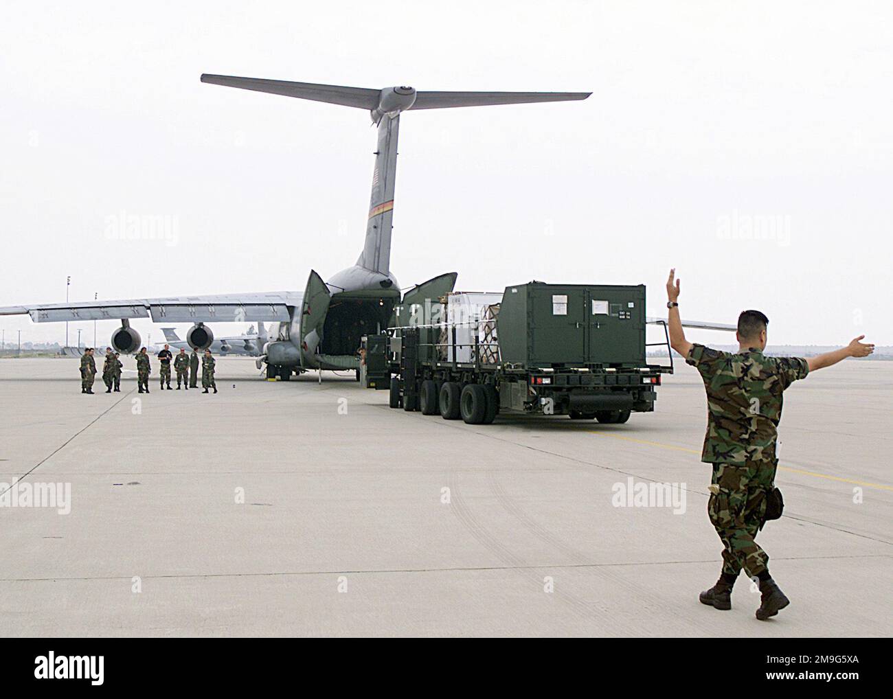 Technical Sergeant Casis Agustin, 56th Aerial Port Squadron, marshals ...