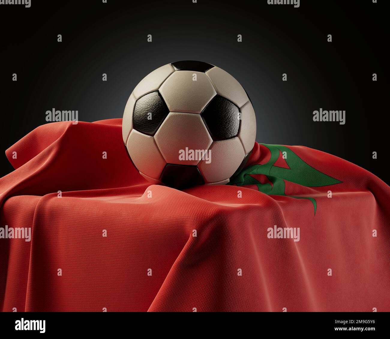 A regular soccer balls resting on a Morocco flag draped over a plinth ...