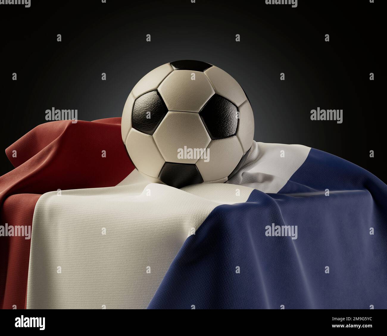 A regular soccer balls resting on a Netherlands flag draped over a ...