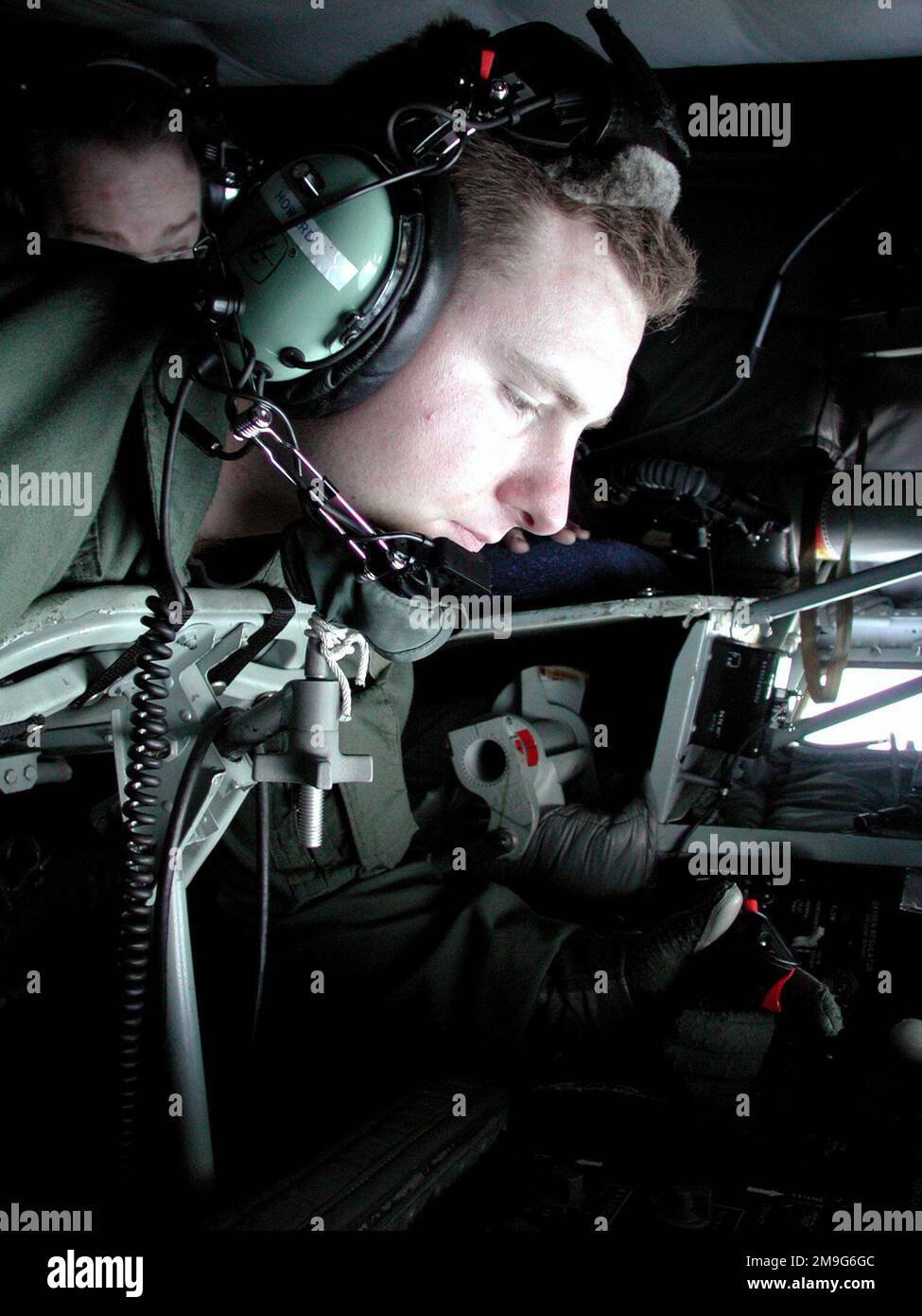 AIRMAN 1ST Class (A1C) Todd Howard, USAF, eases the refueling boom of a ...