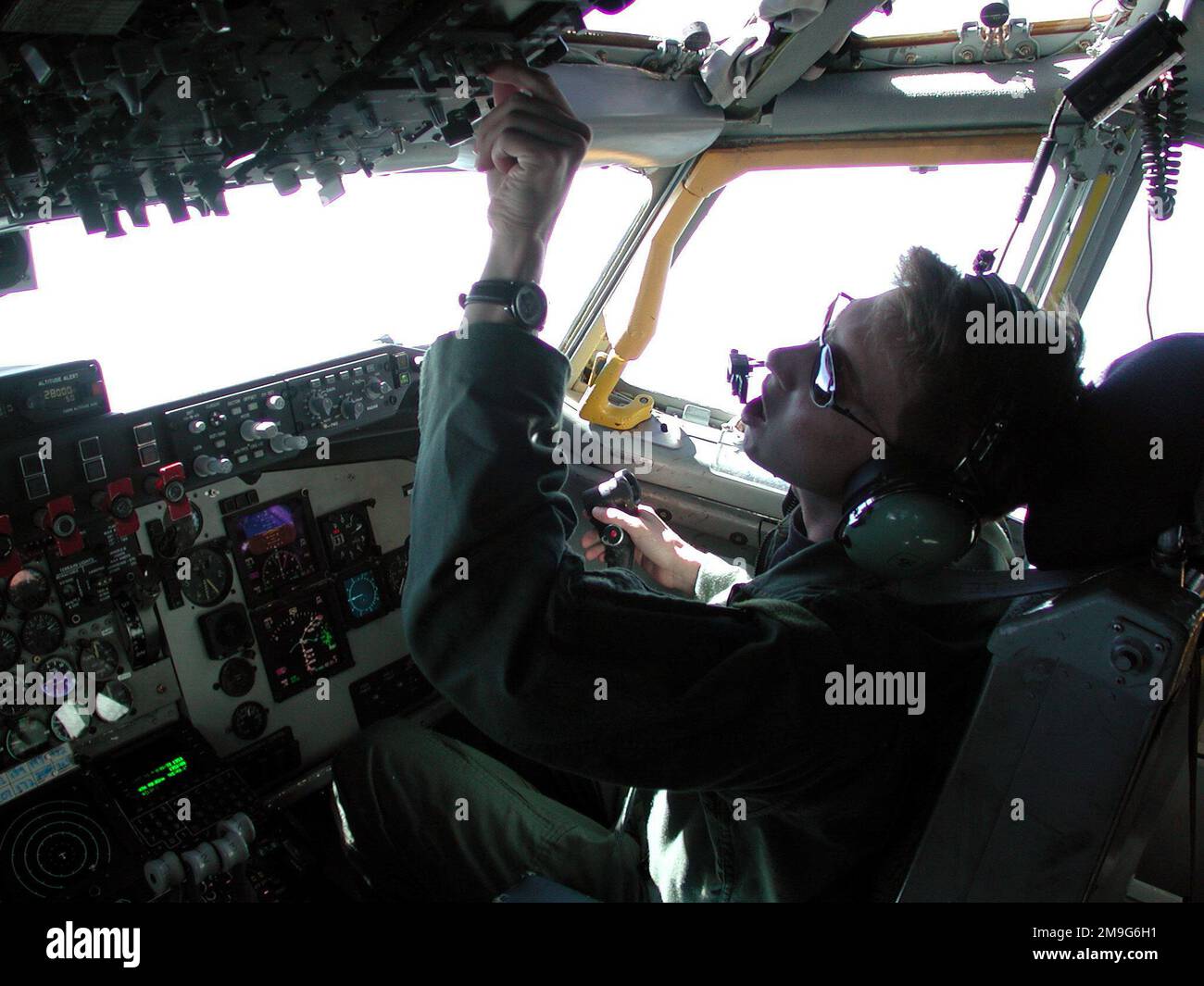 Captain (CAPT) Brad Cook, USAF, a KC-135R Stratotanker co-pilot, makes ...