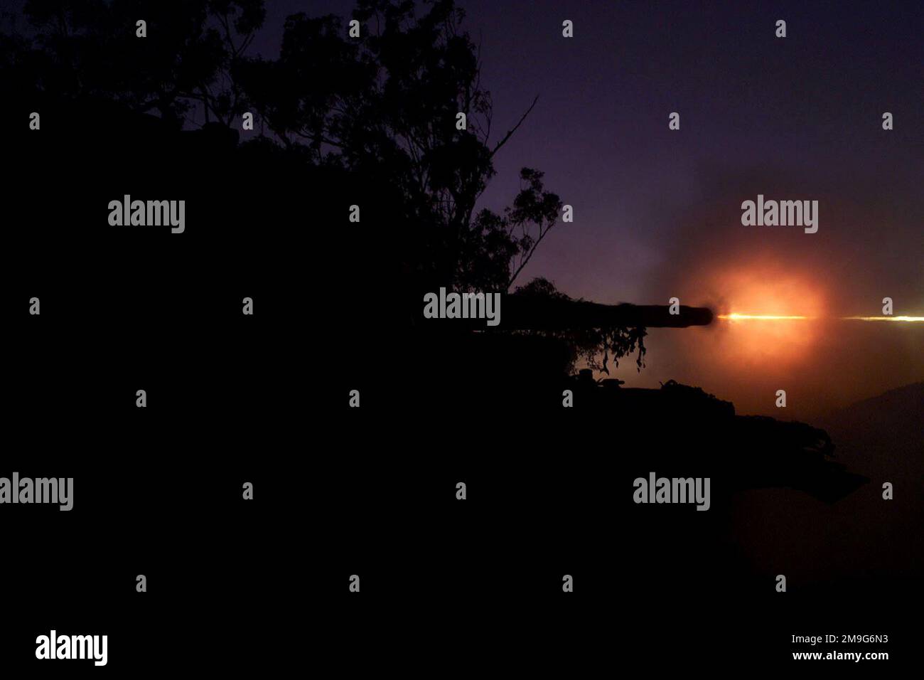 An Australian AS-1 Leopard tank fires 105mm high explosive rounds ...