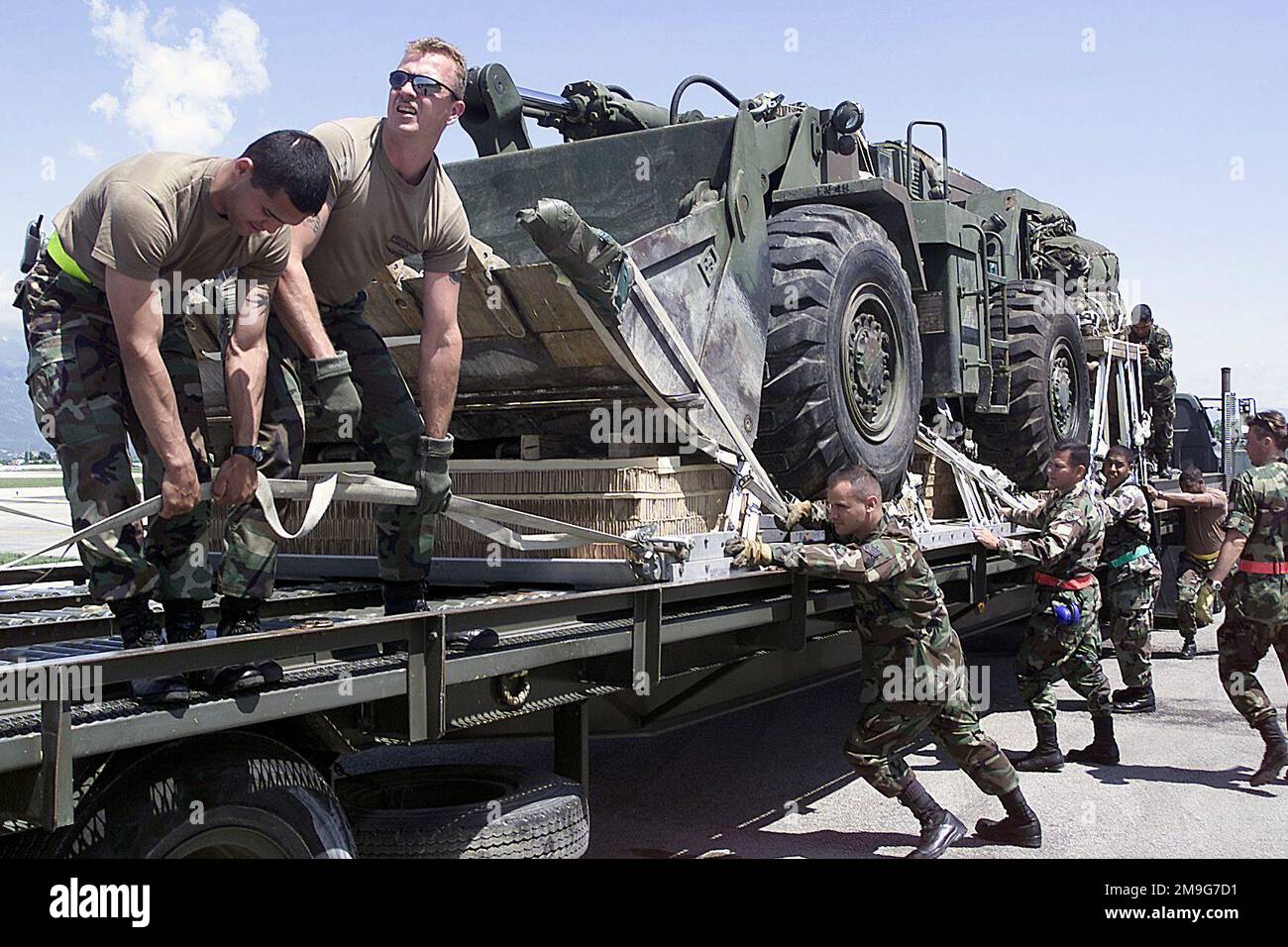 US Army members from HHC Bravo Company, Vicenza, Italy, push a massive ...