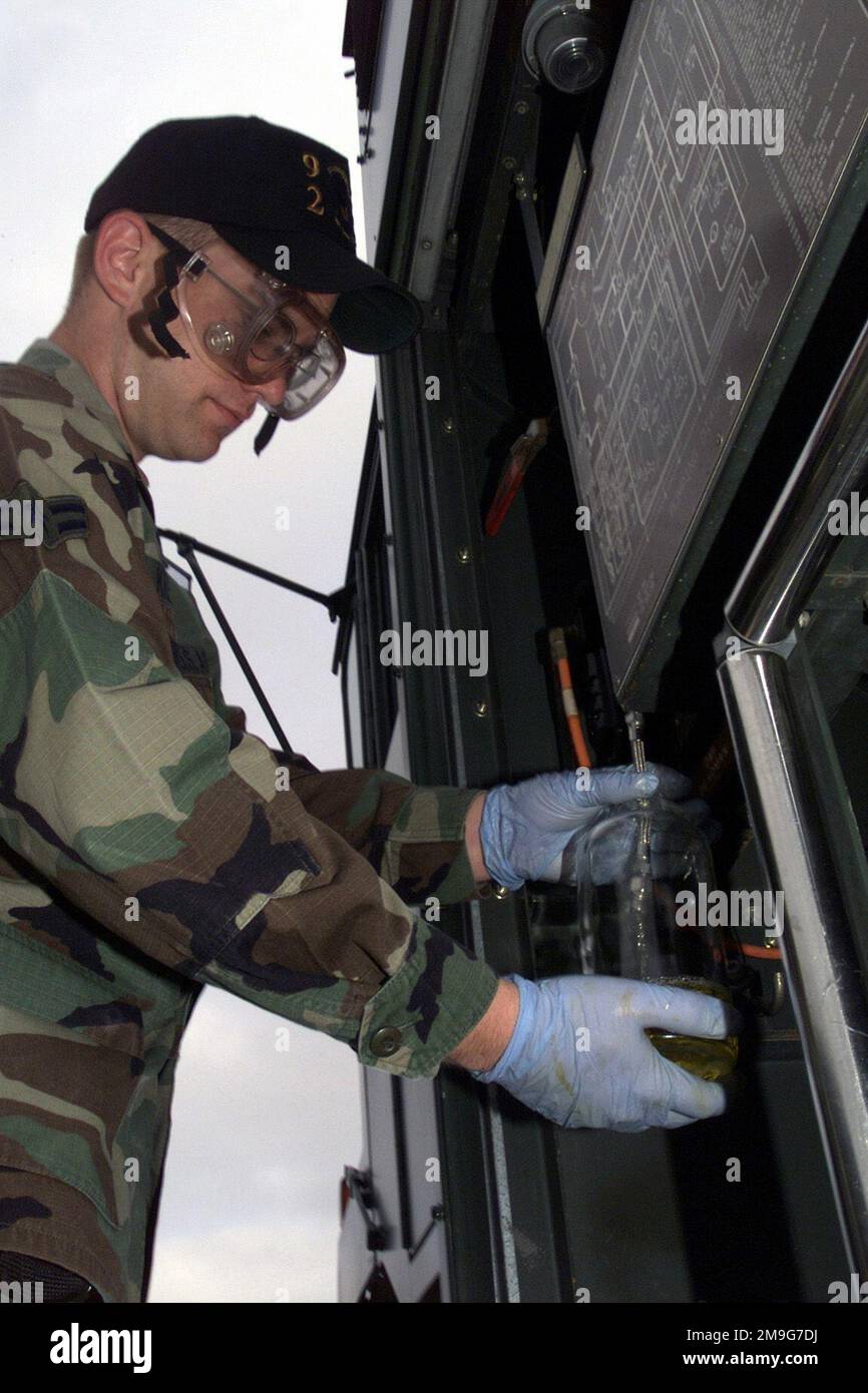 AIRMAN First Class (A1C)Mike Kresser, 92d Supply, removes a fuel sample ...