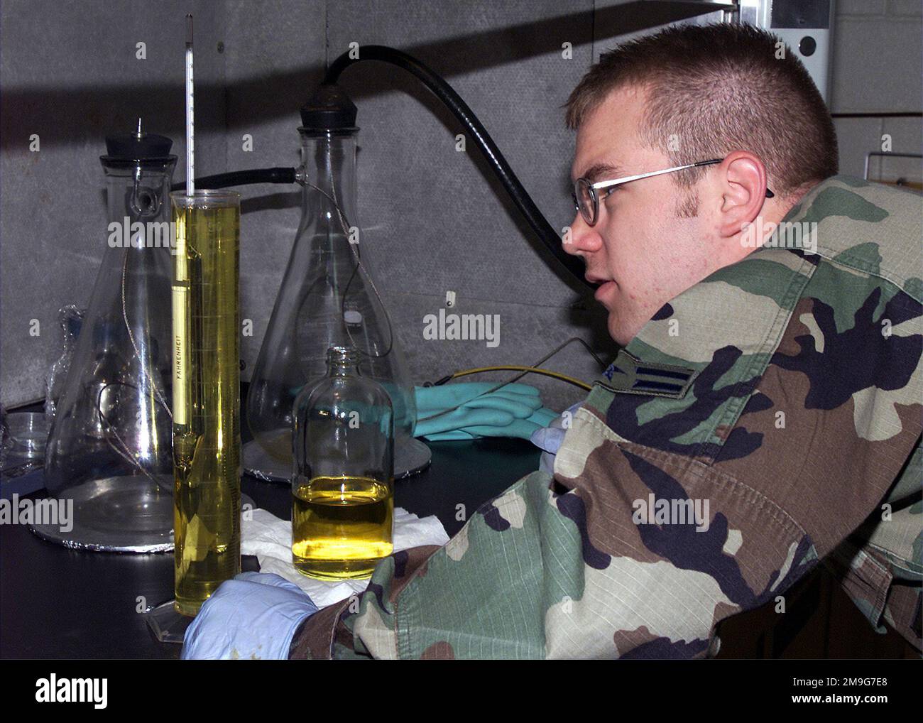 AIRMAN 1ST Class Mike Kresser, 92d Supply, checks the status of the JP8 ...