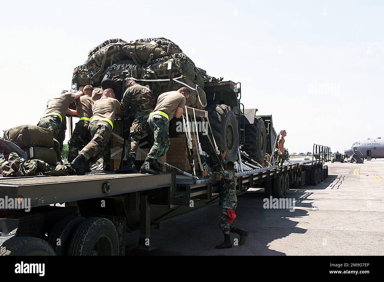 US Army members from HHC Bravo Company, Vicenza, Italy, push a massive ...