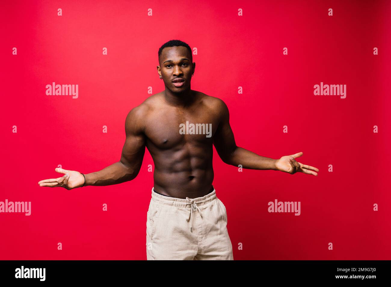 Smiling young african american man guy isolated on yellow background ...