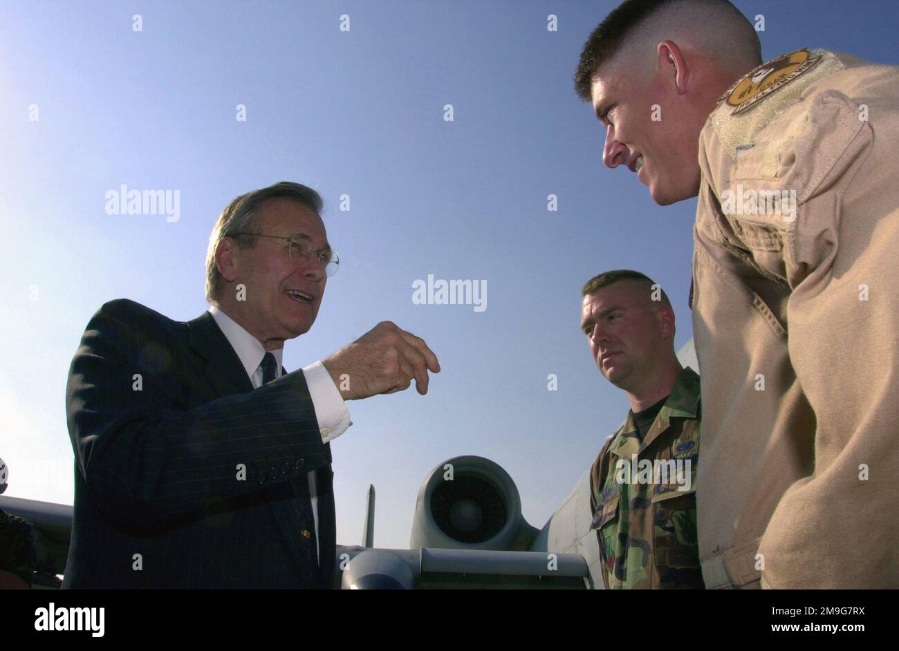 Defense Secretary Donald H. Rumsfeld talks with US Air Force Captain ...